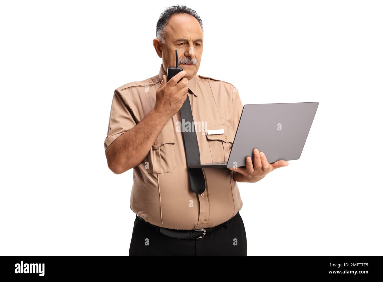 Security guard using a walkie talkie and looking at a laptop computer ...