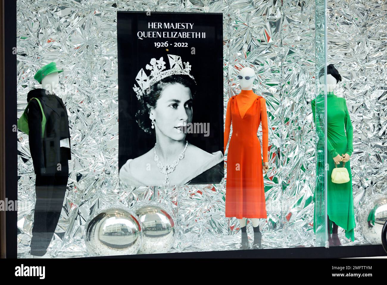 A portrait of Queen Elizabeth II is displayed in a shop window in ...