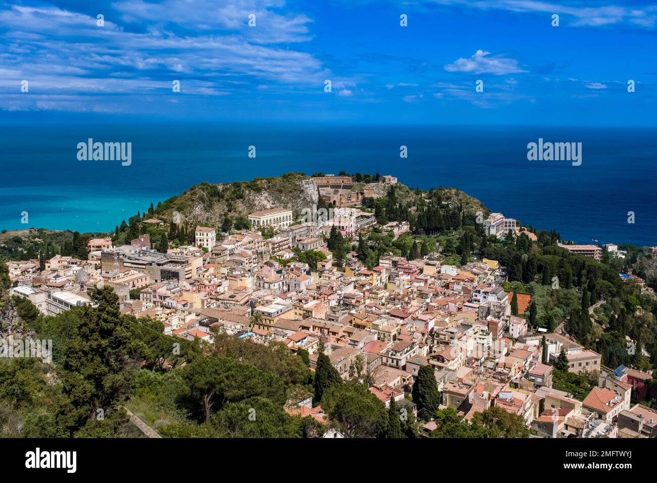 Aerial view of the town of Taormina, located on a hill overlooking the ...