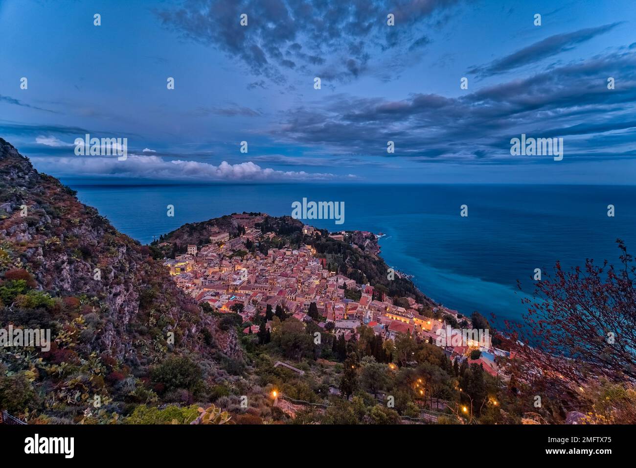 Aerial view of the town of Taormina, located on a hill overlooking the ...