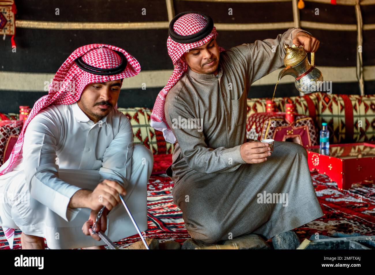 Bedouins preparing coffee, Ashar Valley, AlUla region, Medina province ...