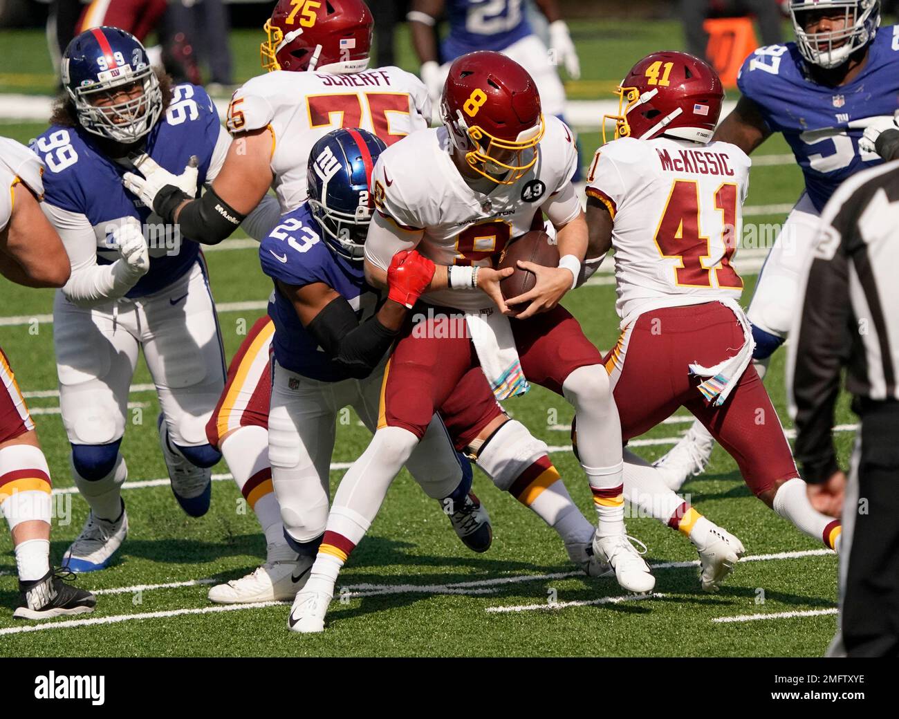 Washington Football Team quarterback Kyle Allen (8) is tackled by New ...