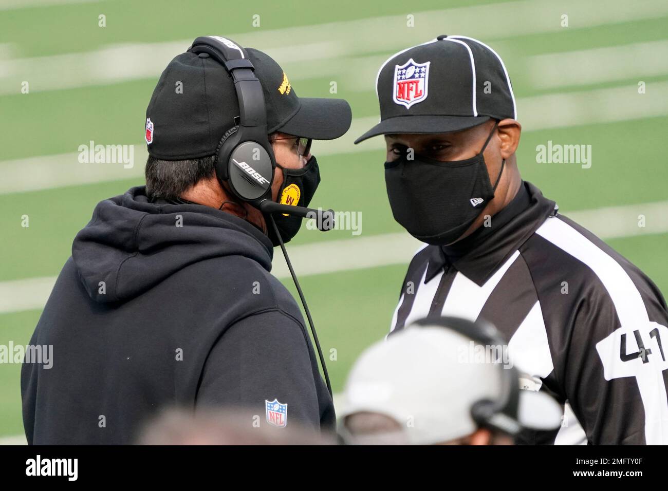 Washington Football Team head coach Ron Rivera, left, talks with side ...