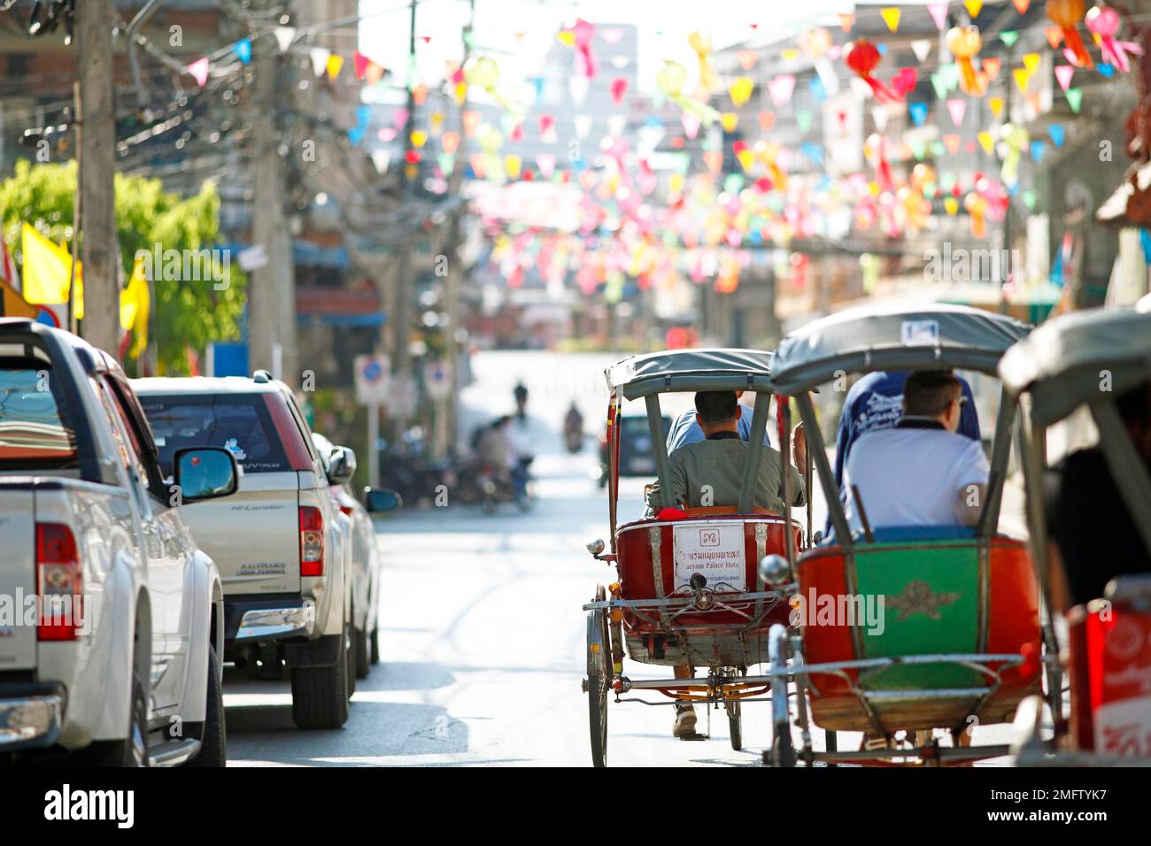 Cycle rickshaws on decorated street, Phrae, Phrae Province, Thailand ...