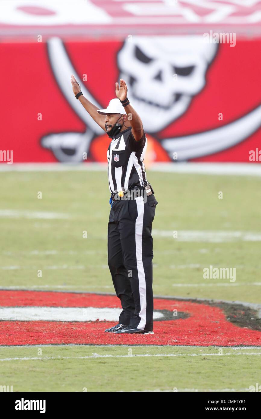 A NFL official signals a penalty in the second half during an NFL ...
