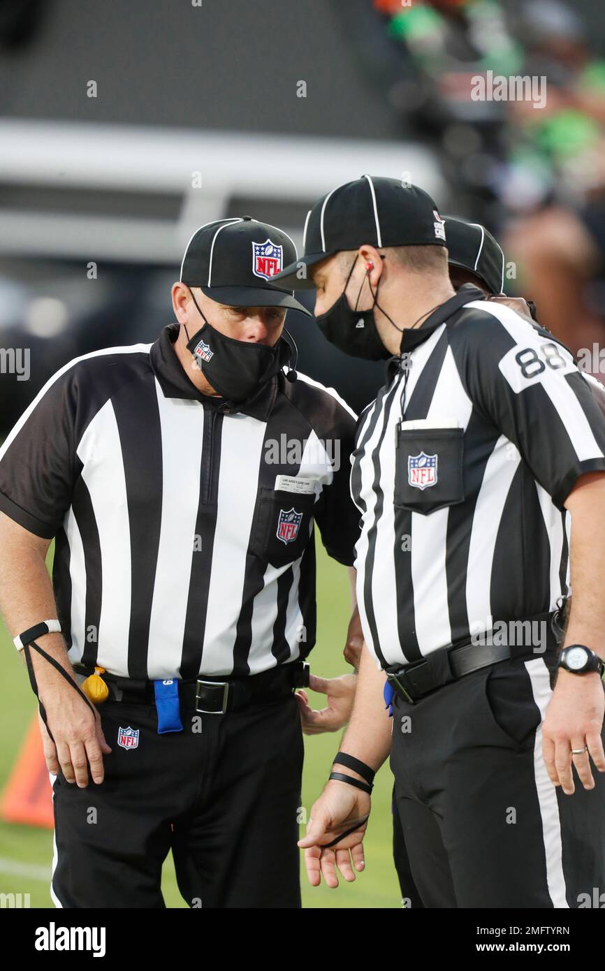 NFL officials discuss a penalty call in the second half during an NFL ...
