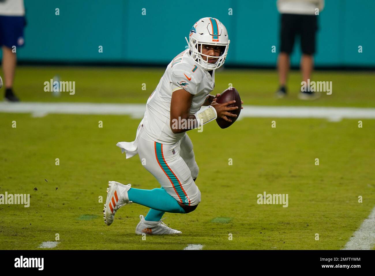Miami Dolphins quarterback Tua Tagovailoa (1) looks to pass the ball ...