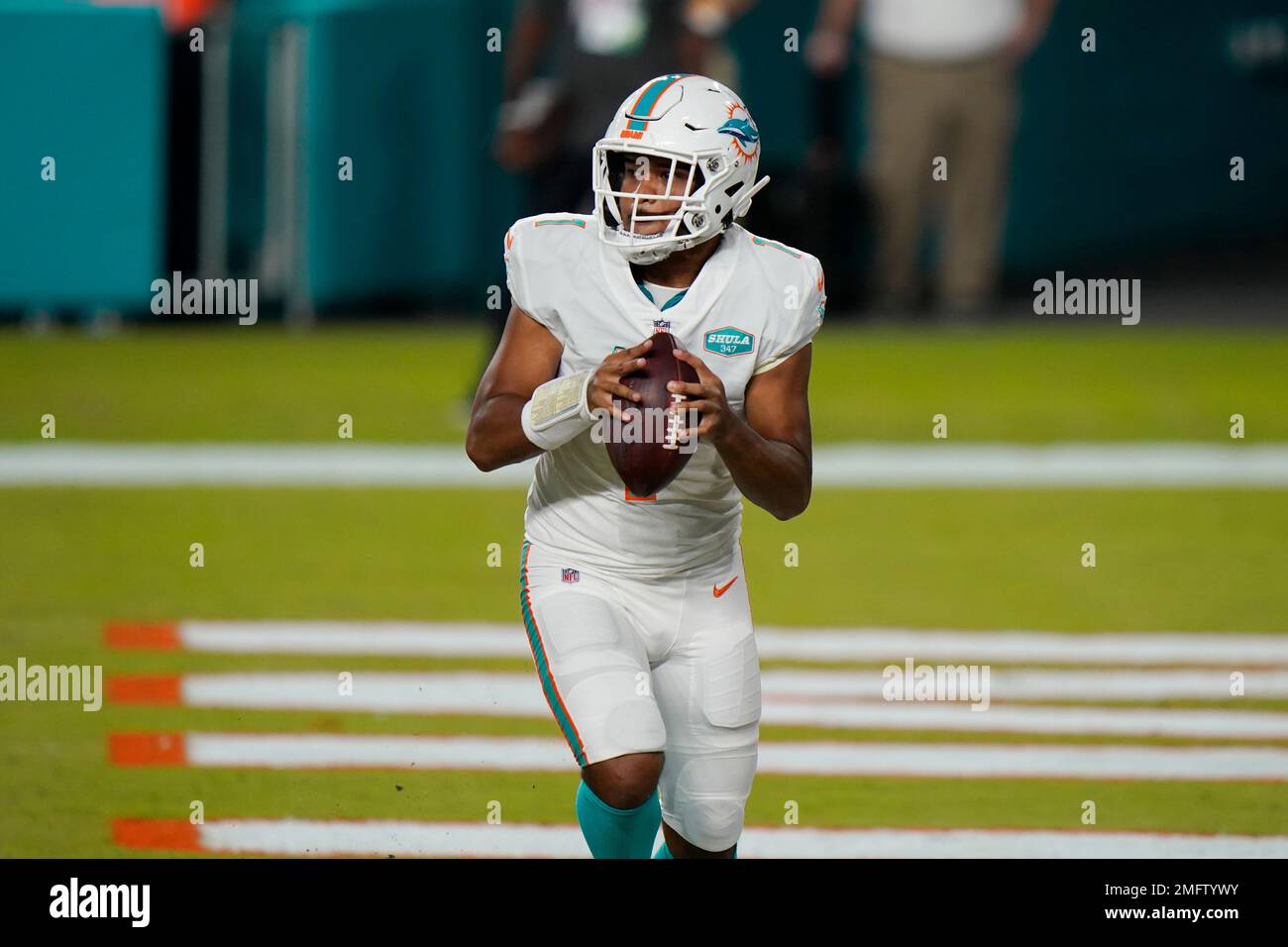 Miami Dolphins quarterback Tua Tagovailoa (1) looks to pass the ball ...