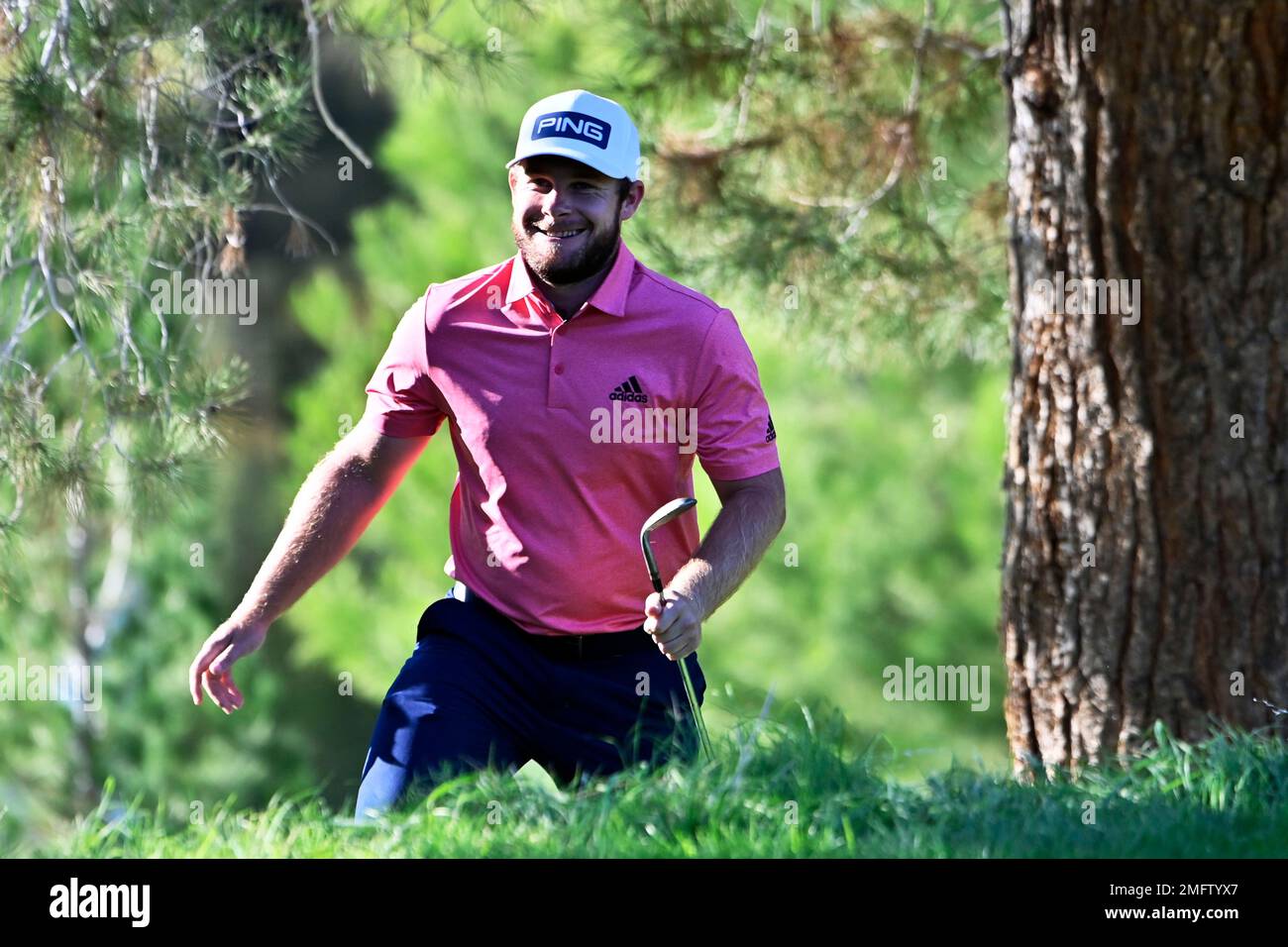 Tyrrell Hatton of England, smiles as he comes out of the weeds during ...