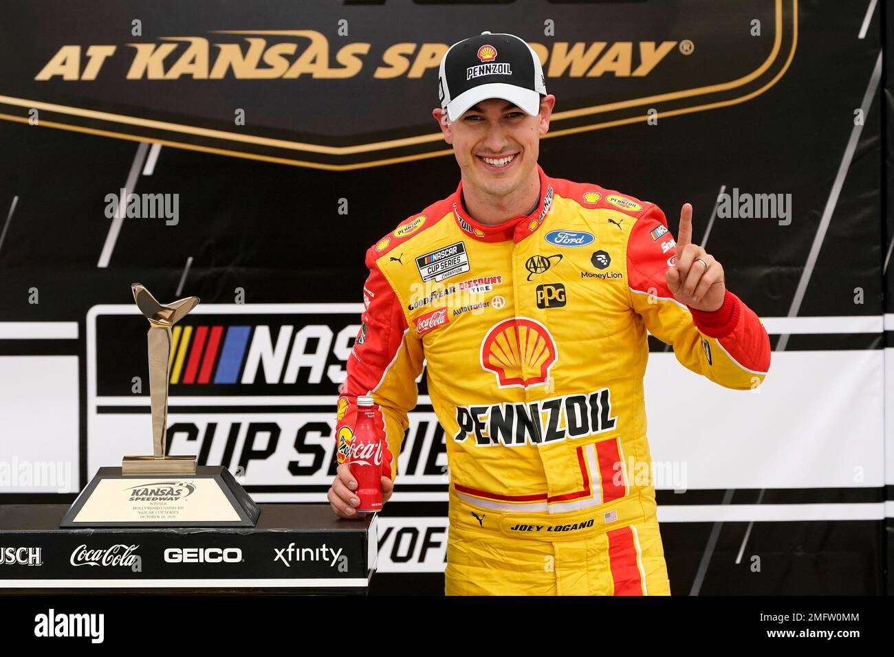 Joey Logano celebrates in victory lane after winning a NASCAR Cup ...