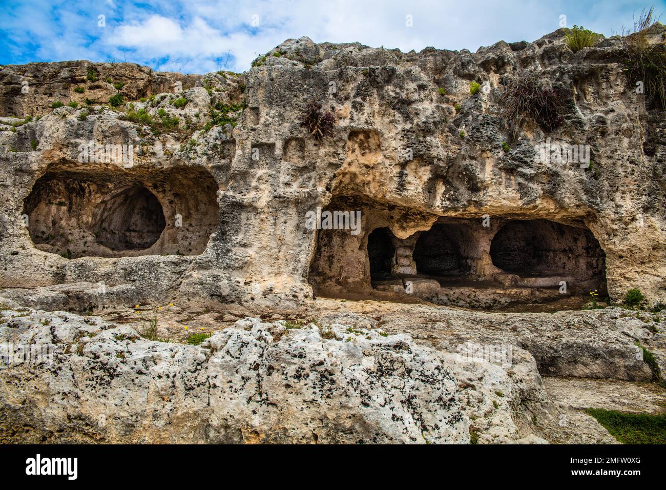 Terrace with images of important deceased carved into the rock ...