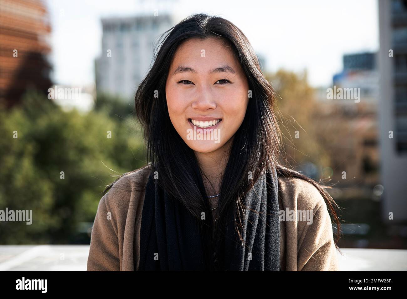 portrait of a happy young woman outdoor - Close up of a smiling asian ...