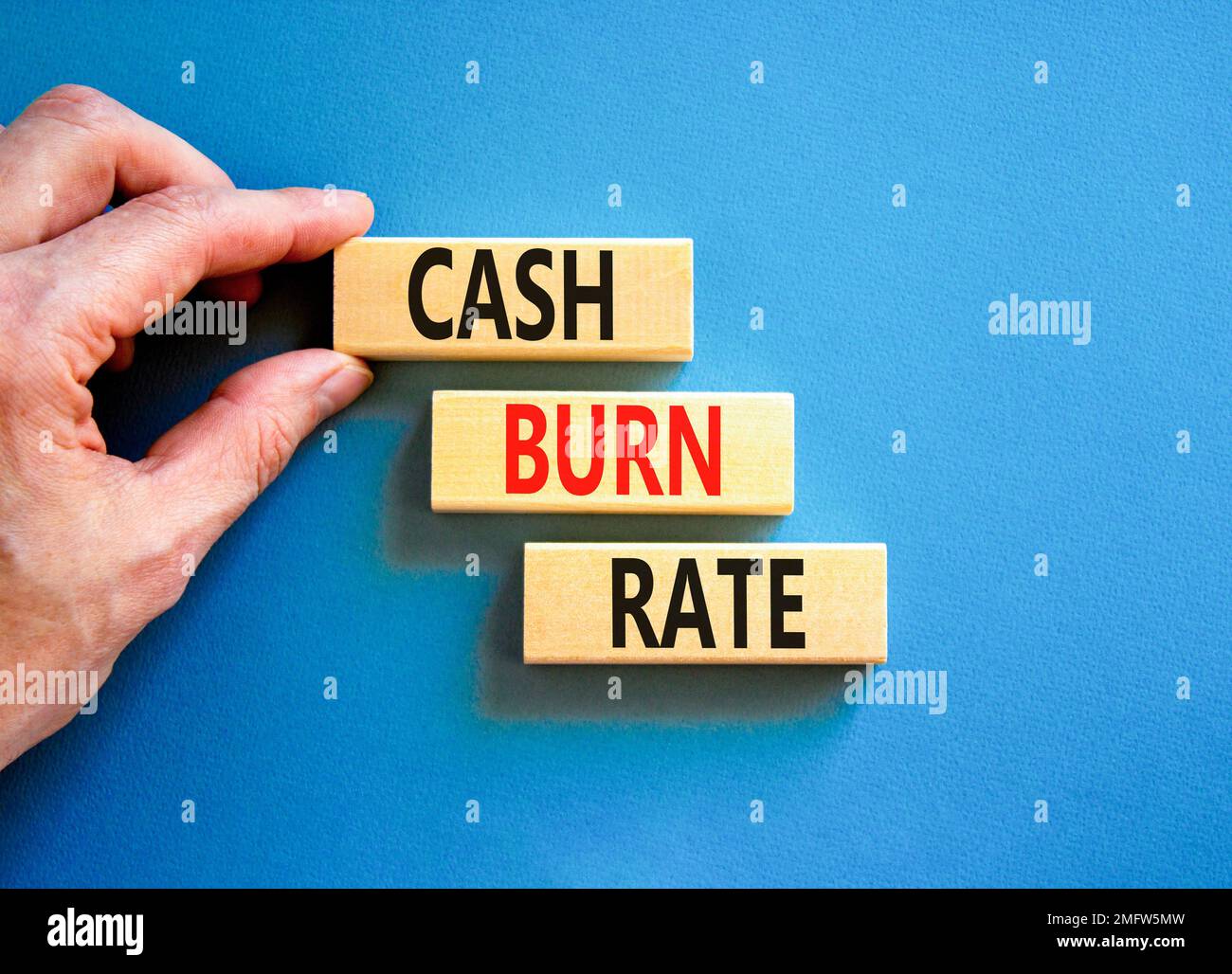 Cash burn rate symbol. Concept words Cash burn rate on wooden blocks on ...