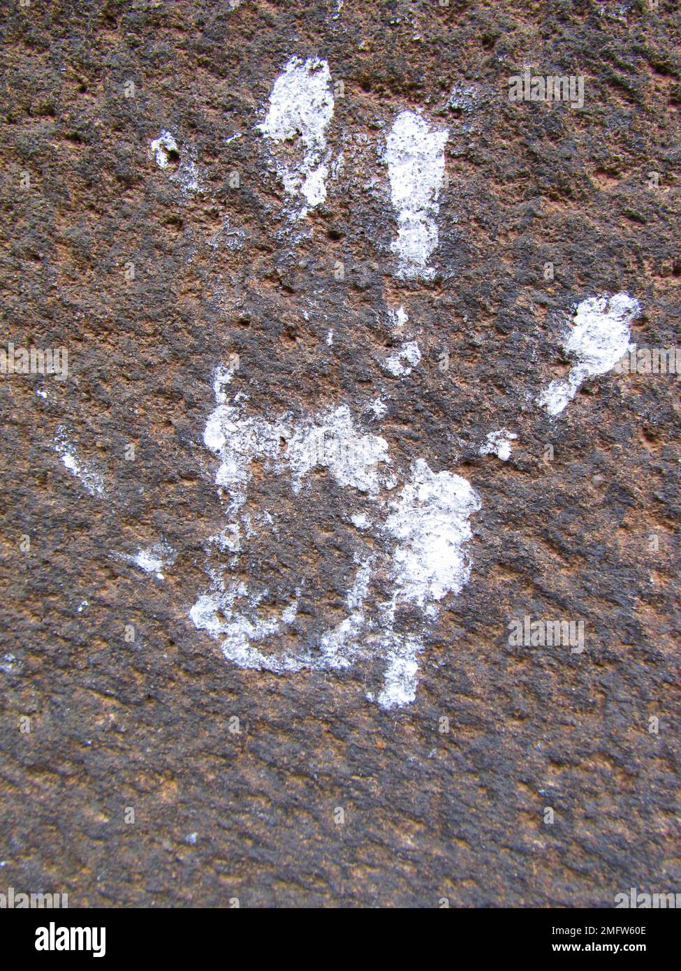 Handprint on stone Stock Photo - Alamy