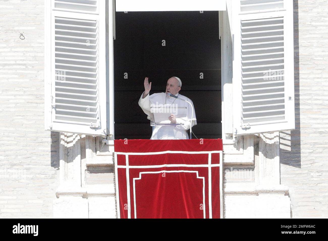 Pope Francis delivers the Angelus noon prayer in St. Peter's Square at ...