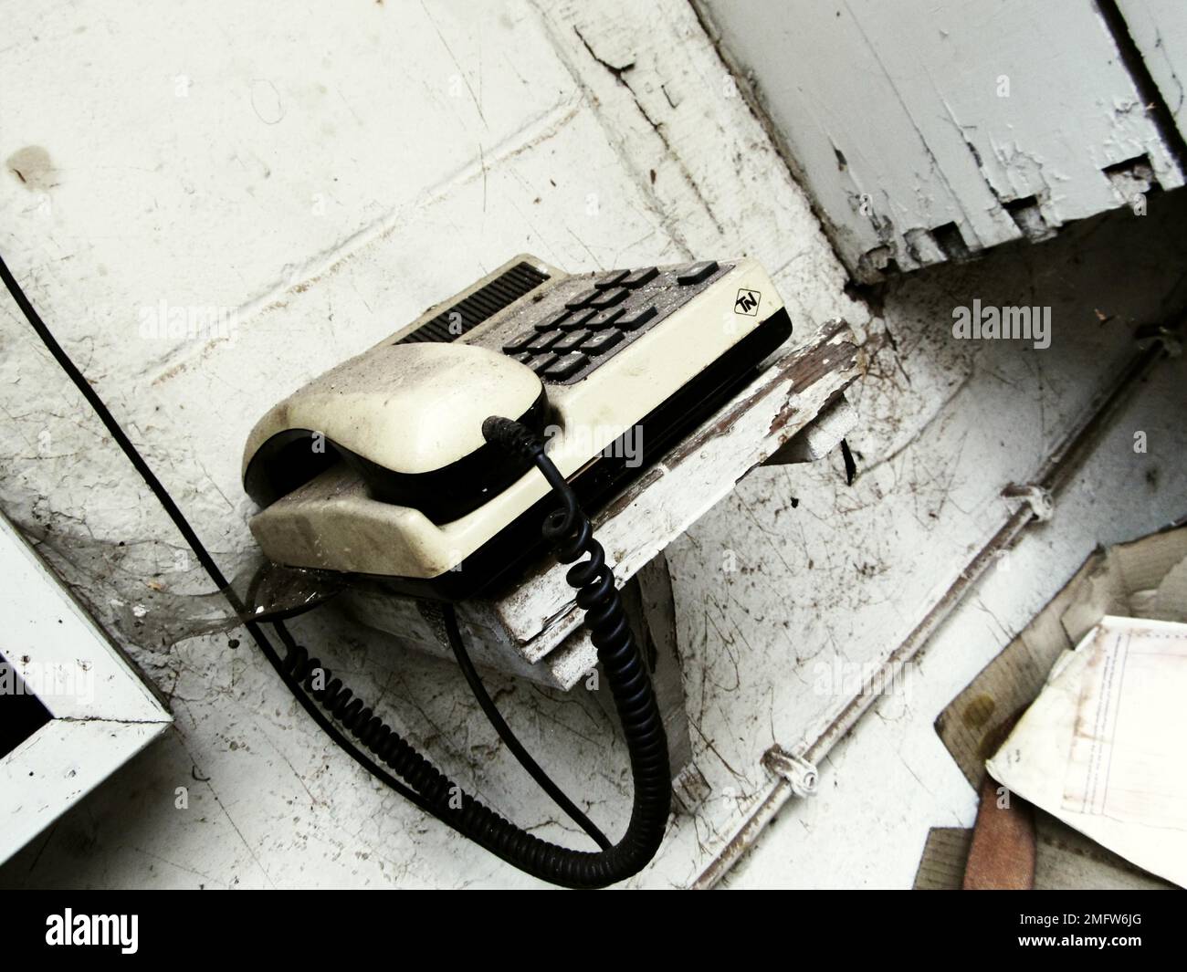 Old push-button telephone in demolition house Stock Photo - Alamy