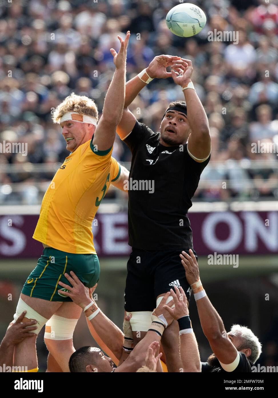 New Zealand's Tupou Vaa'i , right, leaps to take the lineup ball from ...