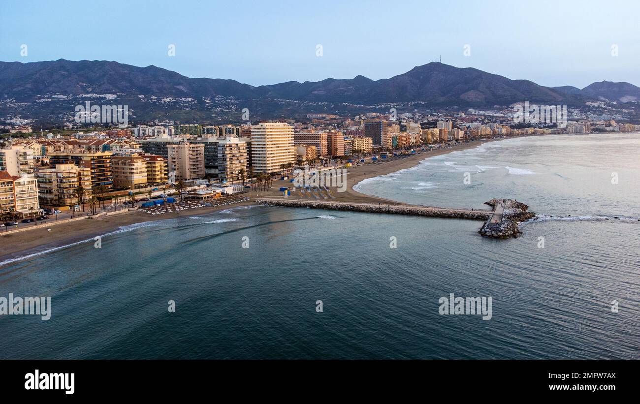Aerial view of Fuengirola city seafront, beach, hotels, mountains and ...