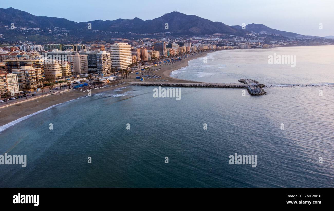 Aerial view of Fuengirola city seafront, beach, hotels, mountains and ...