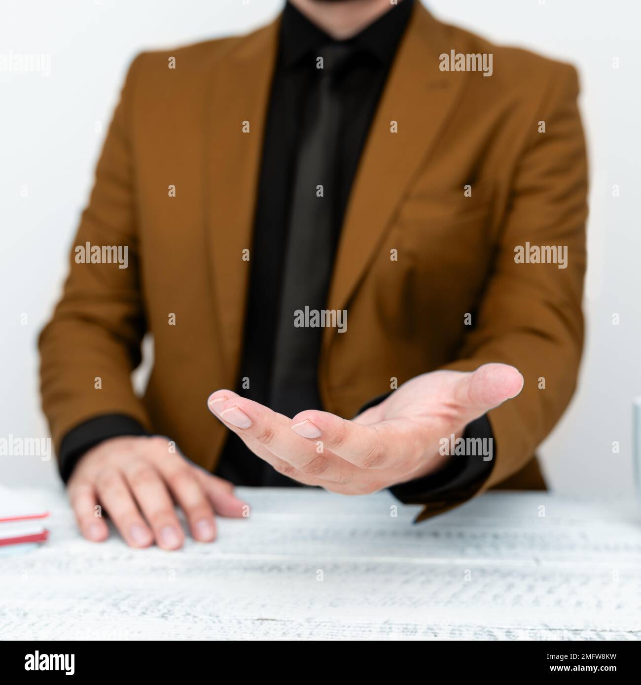 Businessman in Brown jacket Holding Important Message In One Hand. Man ...