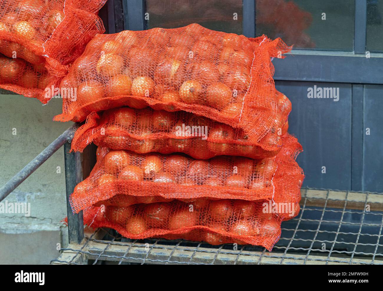 Stacks of Red Onions Produce in Sacks Farmers Market Stock Photo - Alamy