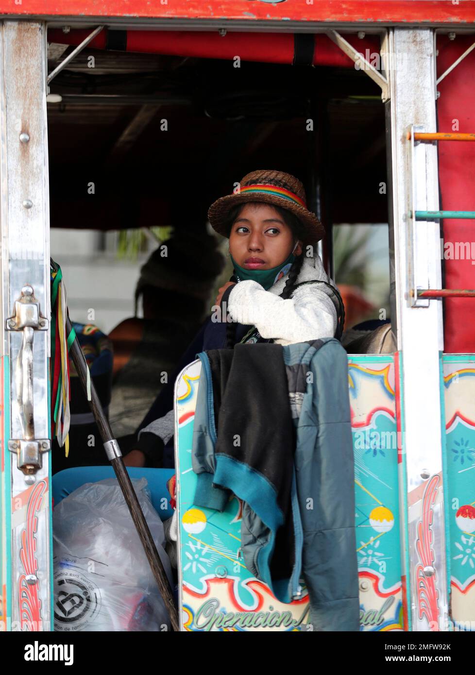 An Indigenous woman sits inside a bus, in Ibague, Colombia, Saturday ...