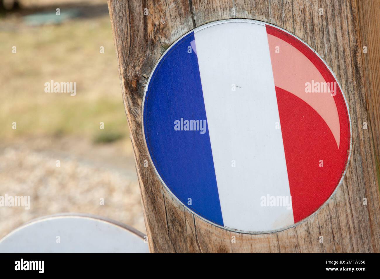 French flag of France round stickers in wooden pole in blue white red ...