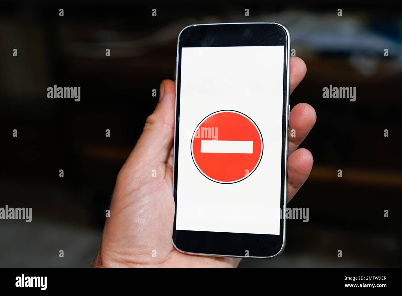 No trespassing pass sign forbidden in screen phone cell in hand Stock ...