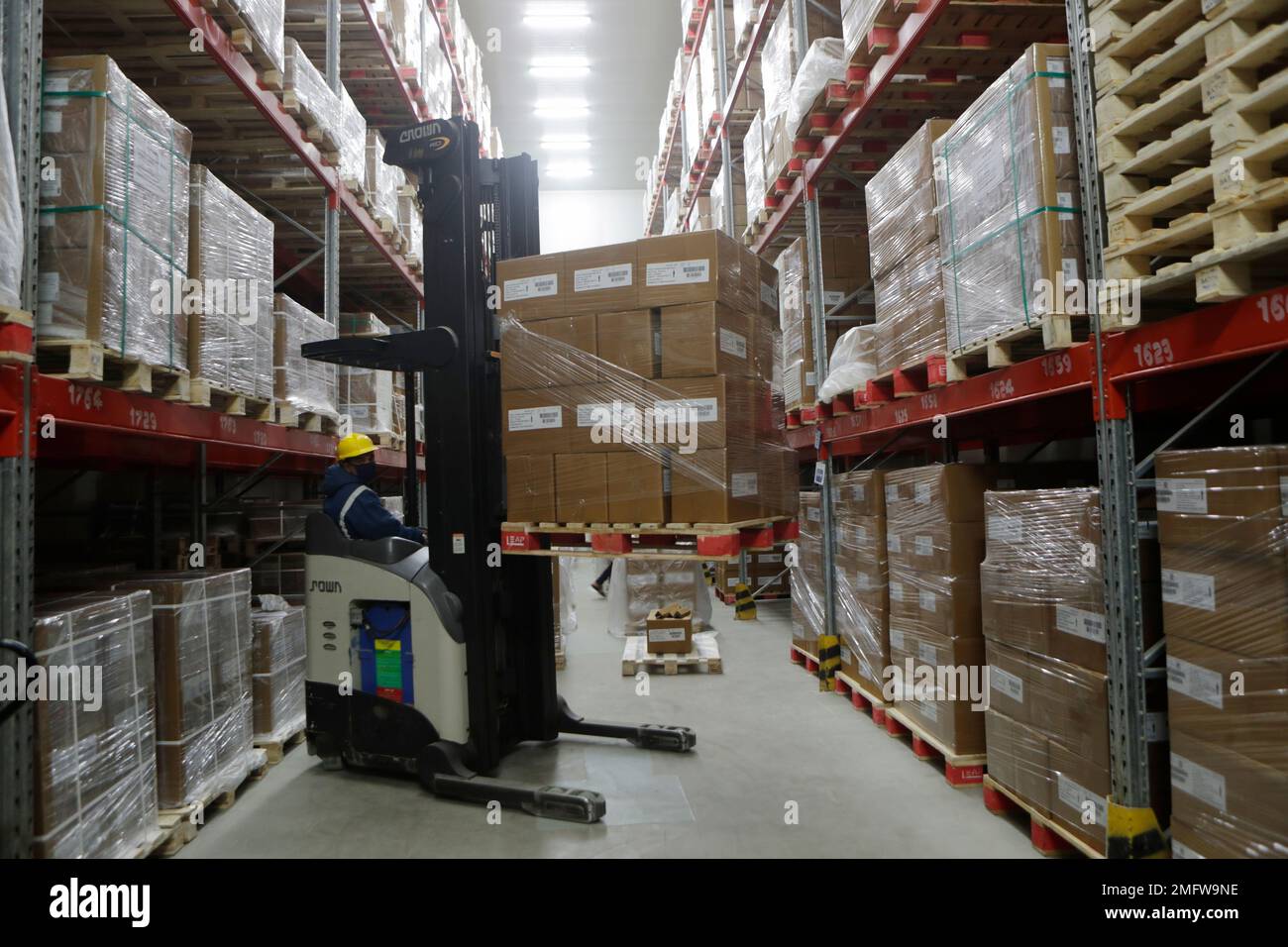An employee works at Snowman Logistics, a cold storage company, in ...