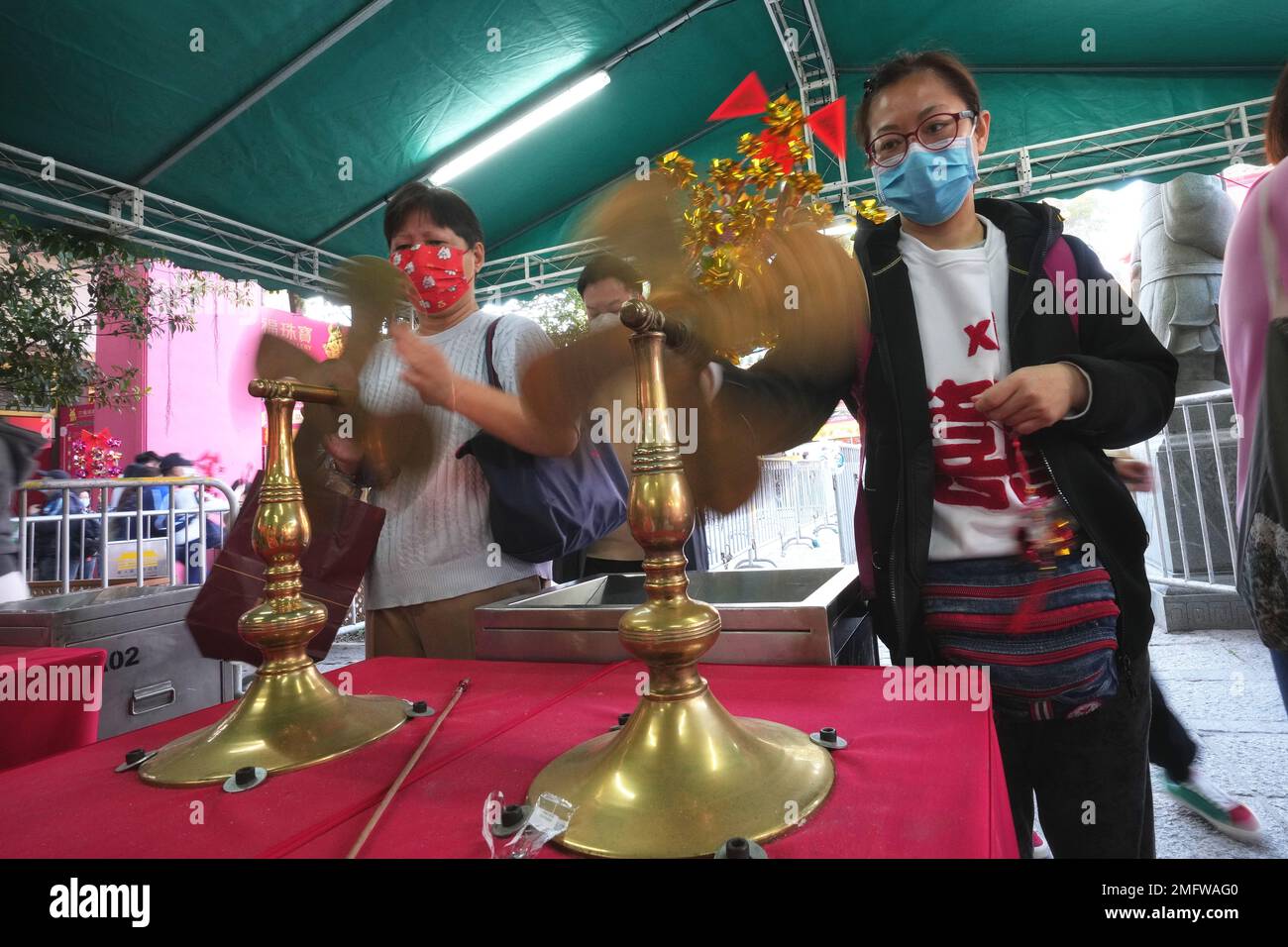 People pray with wheels to celebrate the Lunar New Year at Che Kung Temple in Sha Tin. 23JAN23 ...