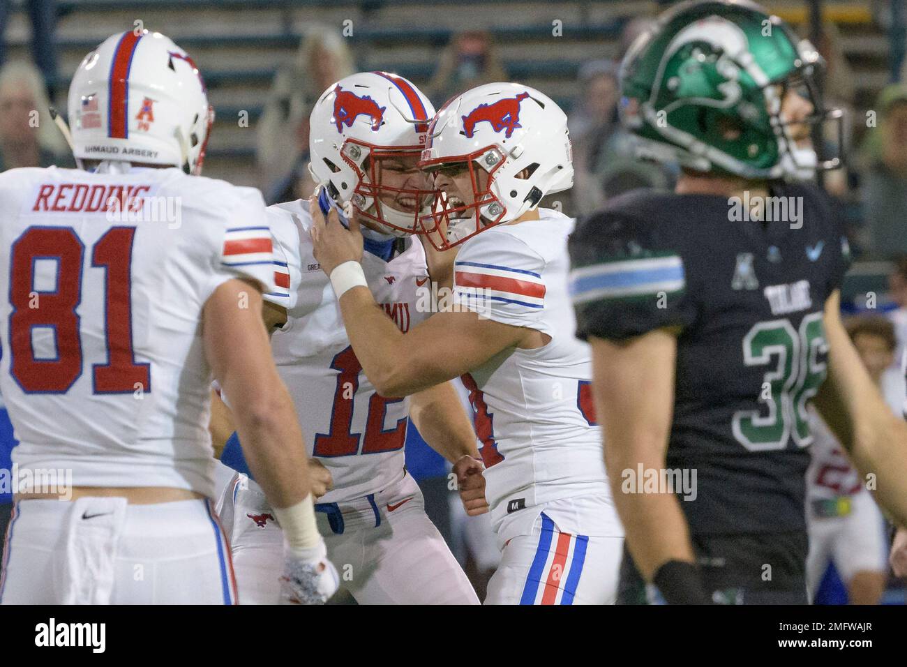 SMU placekicker Chris Naggar (34) celebrates with quarterback / holder ...