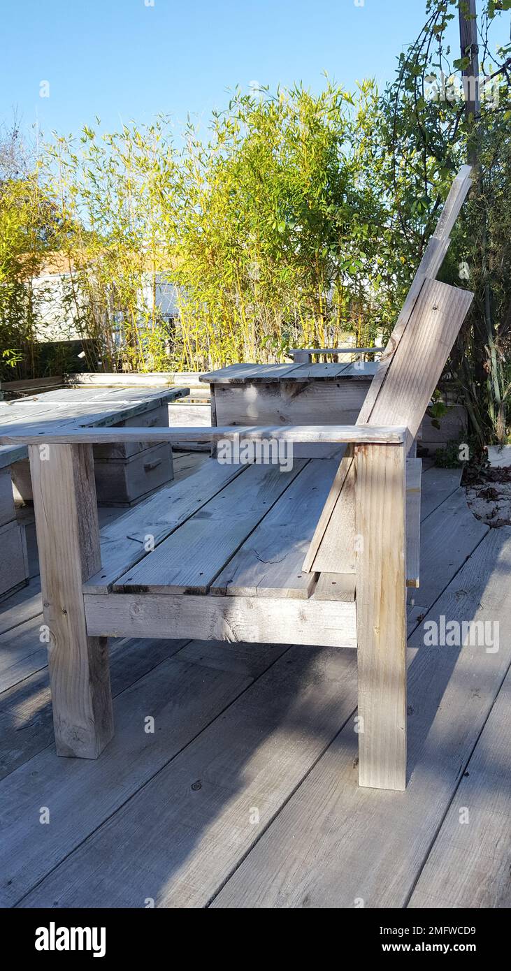 side view of large wood chair home made with palet wooden Stock Photo ...