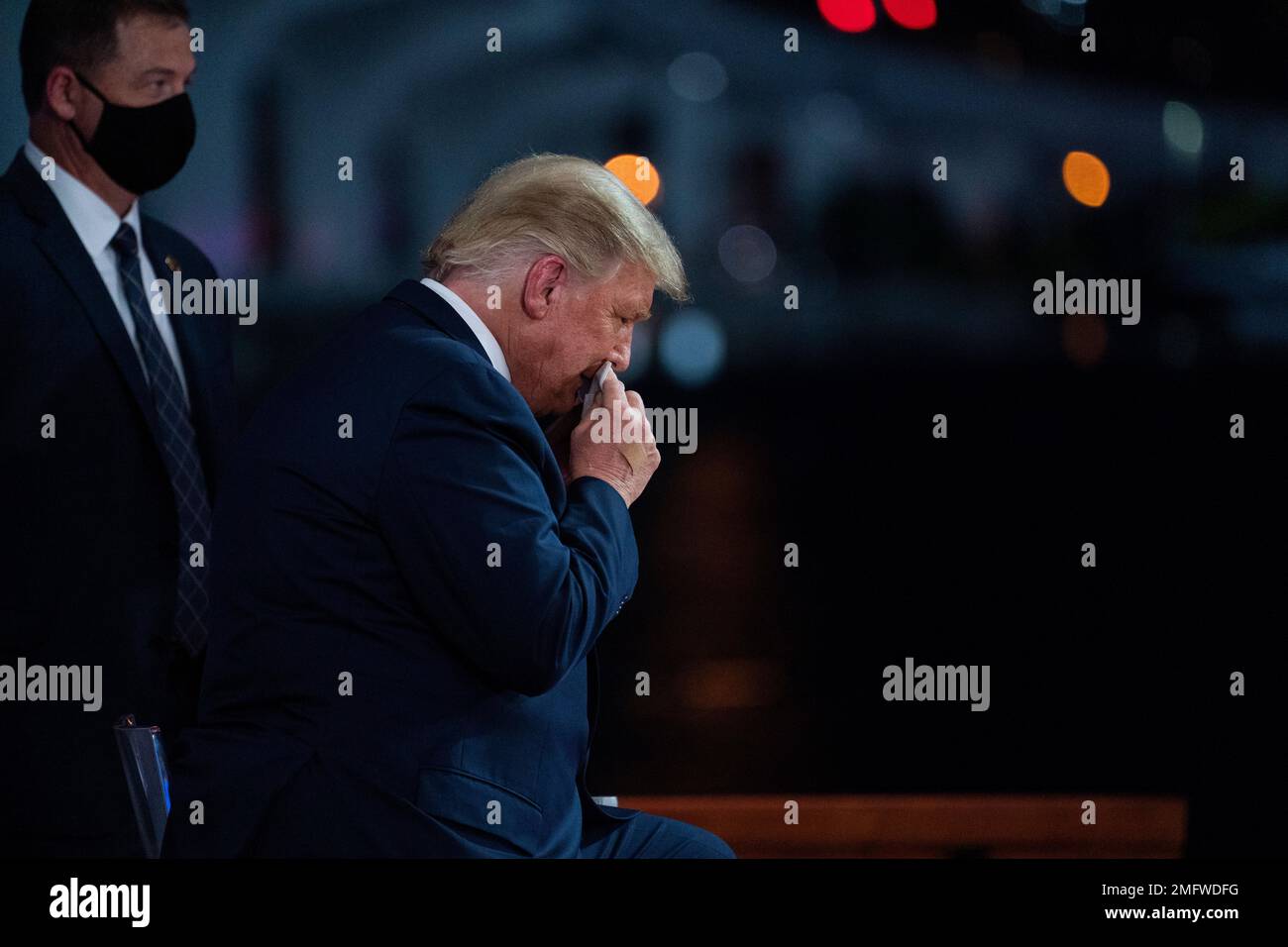 President Donald Trump wipes away sweat during an NBC News Town Hall ...