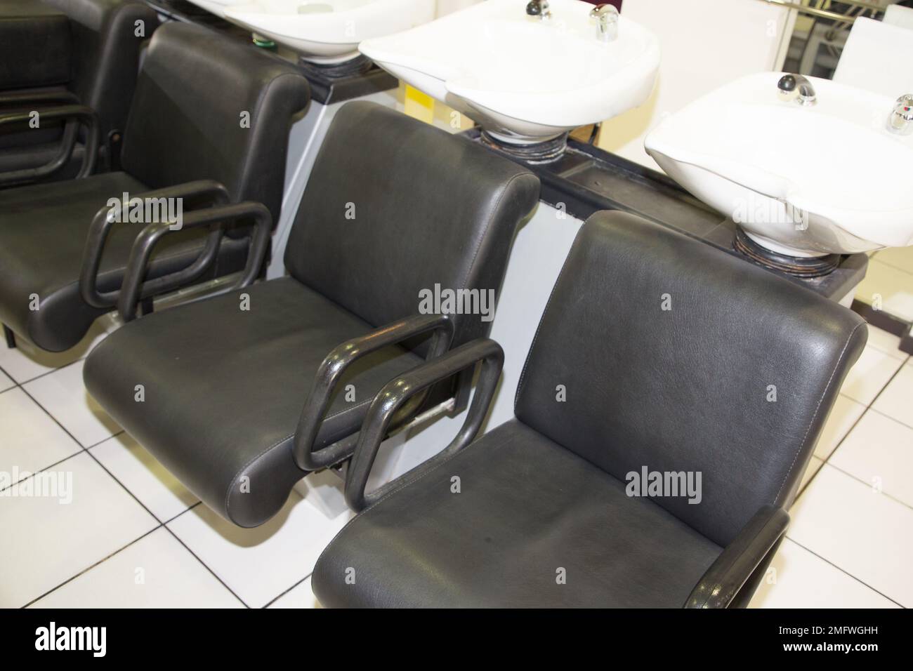Row of hair washing sinks hi-res stock photography and images - Alamy