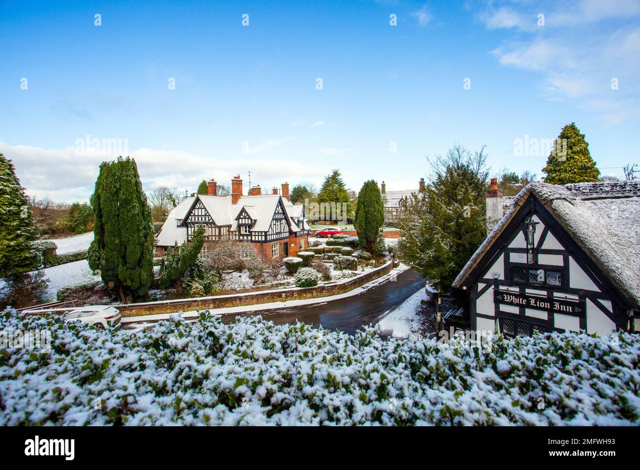 Snow covered black and white half timbered houses in the picturesque ...