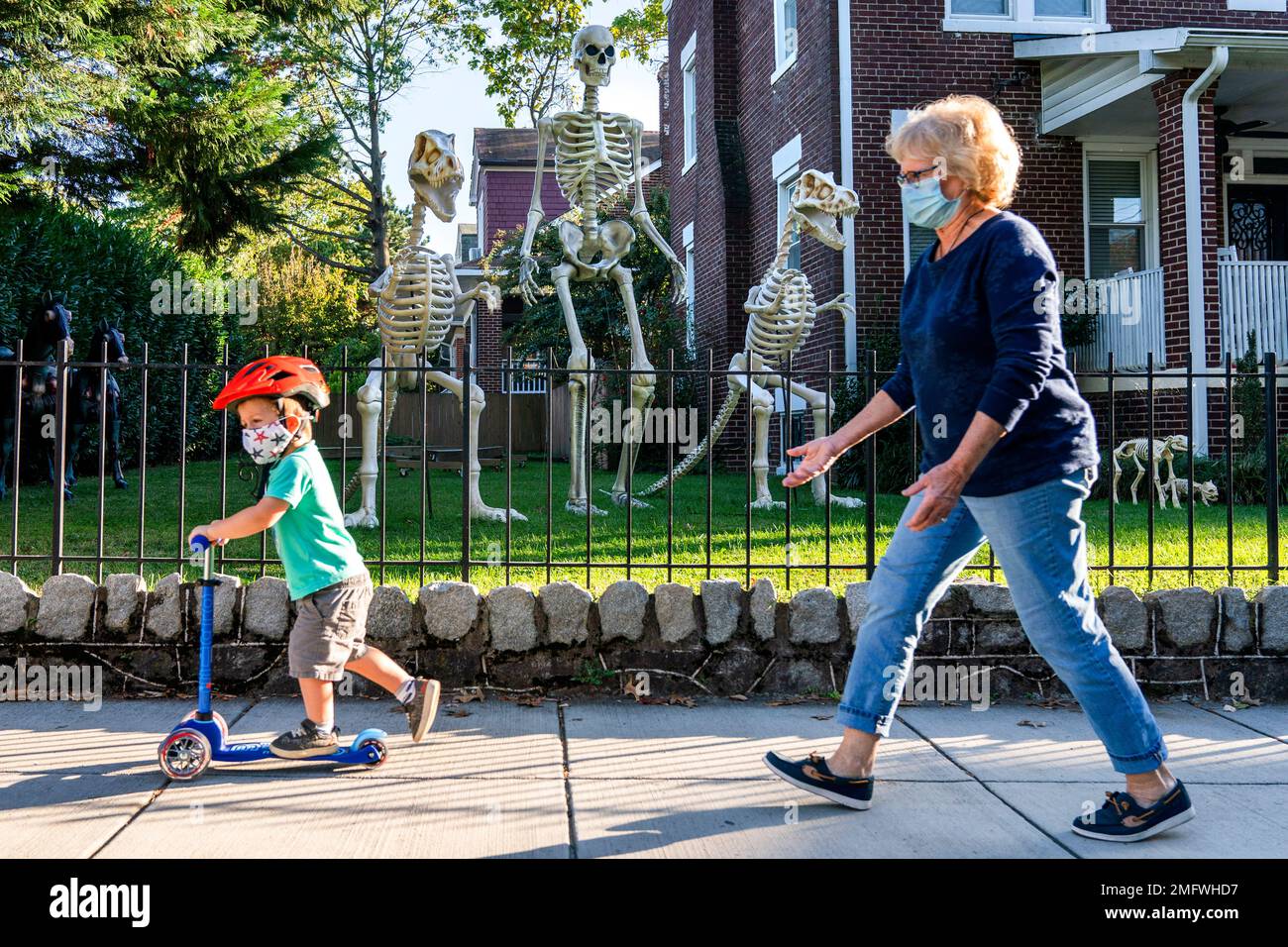 Sam McNamara, 3, of Washington, left, followed by his grandmother ...