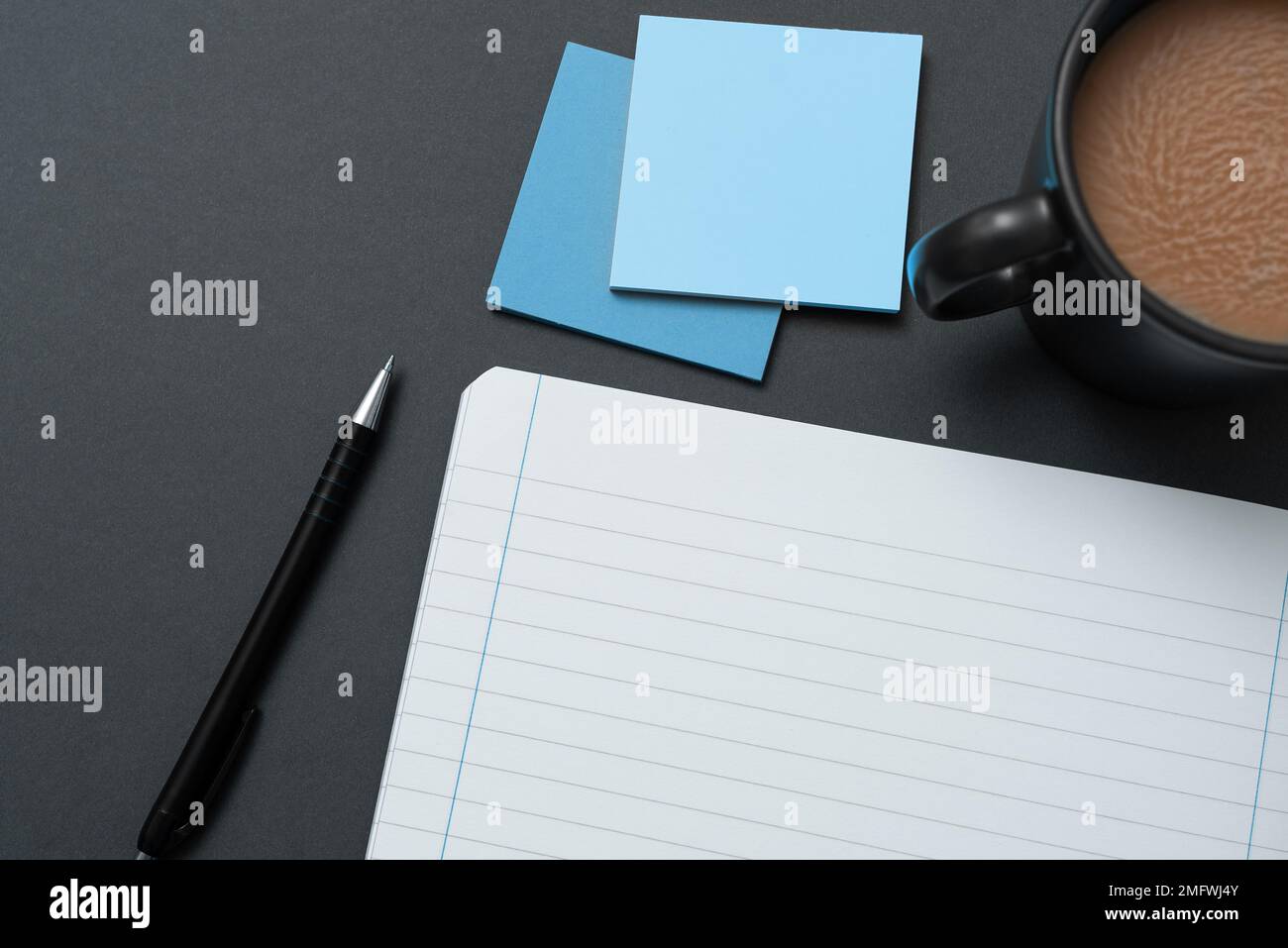 Coffee Cup Standing on Desk. Important infrormation written on paper ...