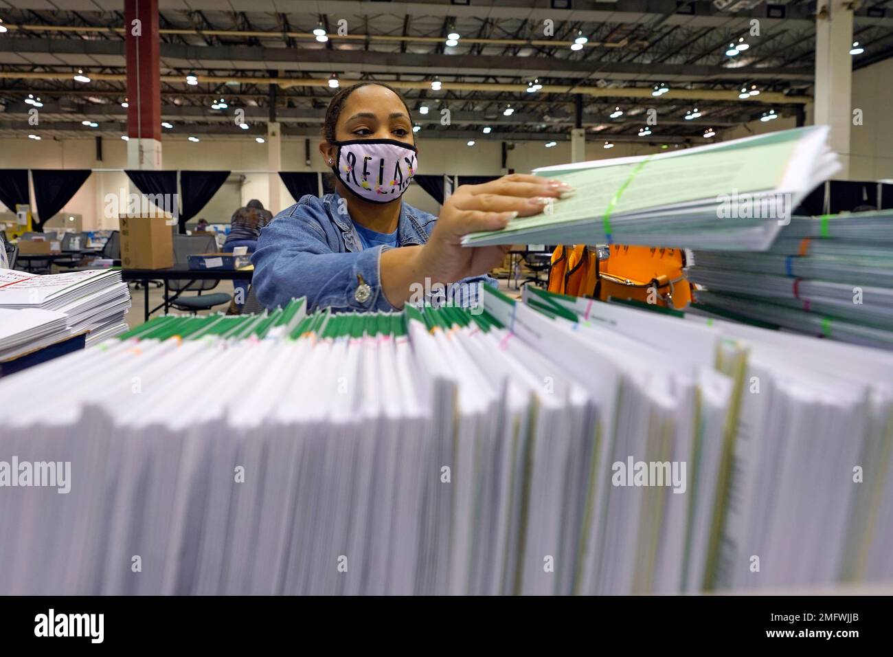 Harris County election worker Romanique Tillman prepares mail-in ...
