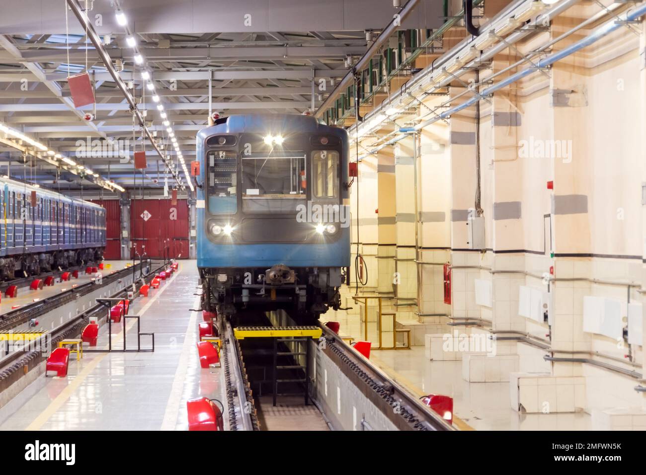 Electric locomotive metro subway with headlights on arrived at the ...