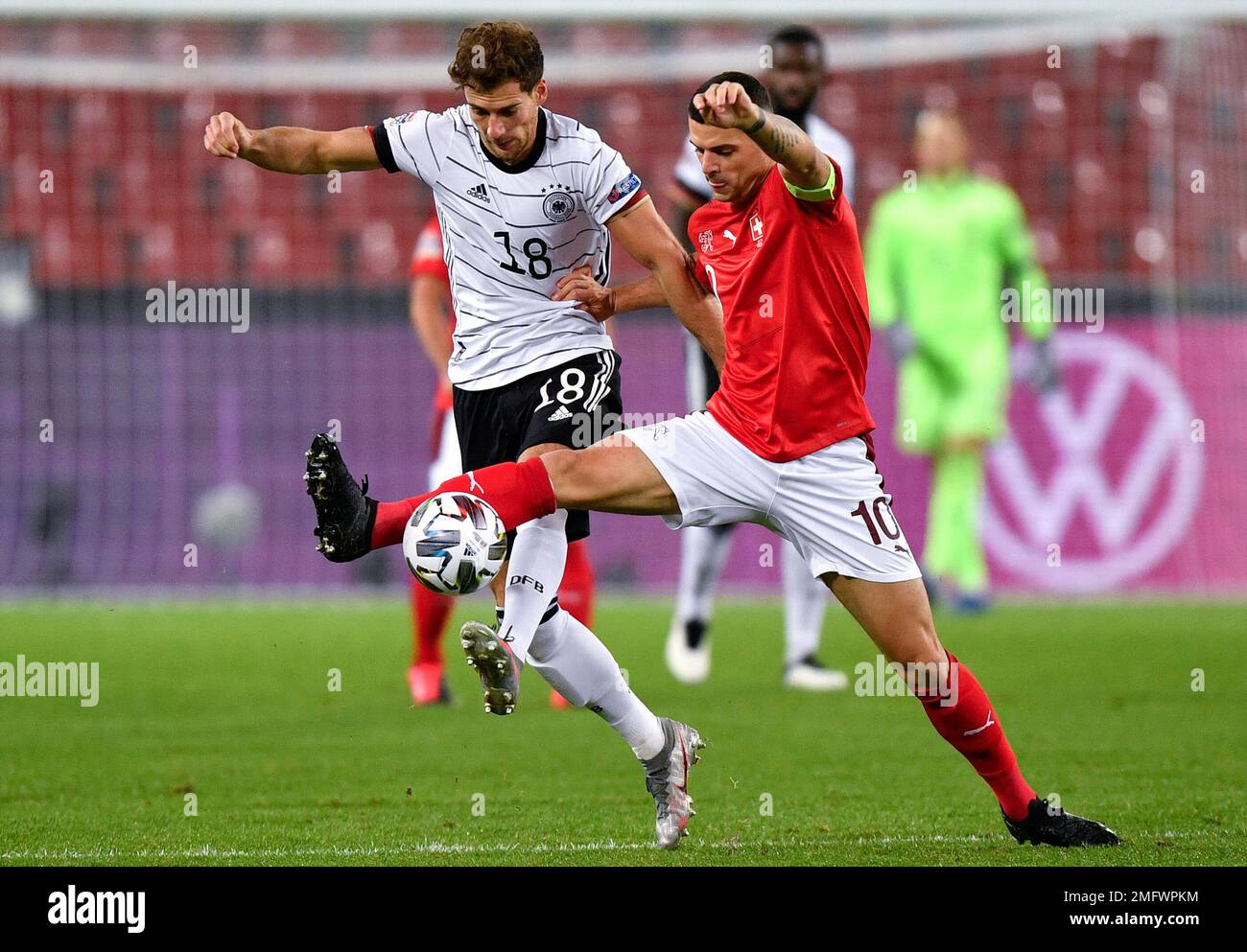 Germany's Leon Goretzka, left, and Switzerland's Granit Xhaka battle ...