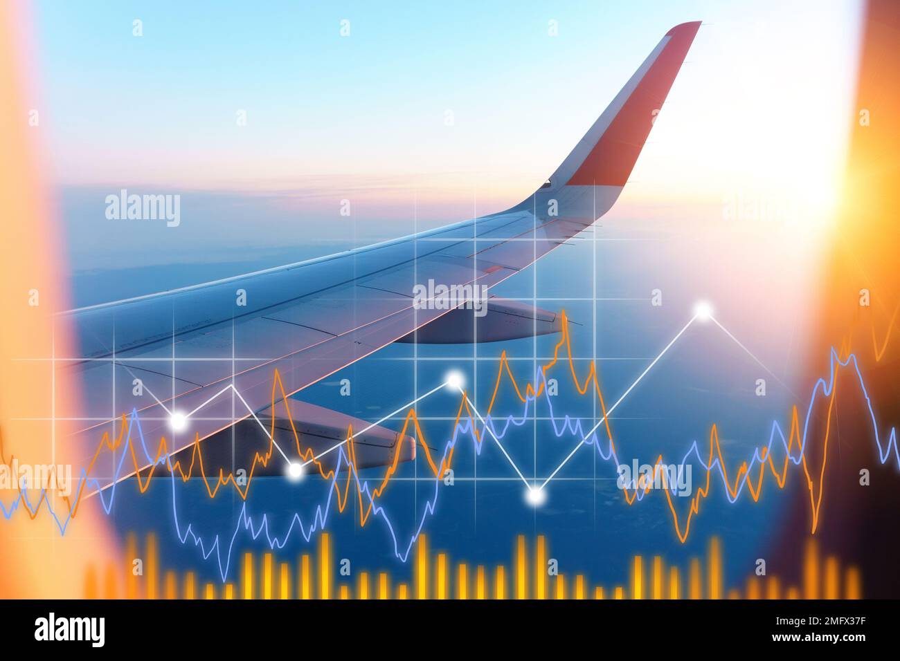 Plane flying above the clouds. View from the wing of the plane. Travel ...