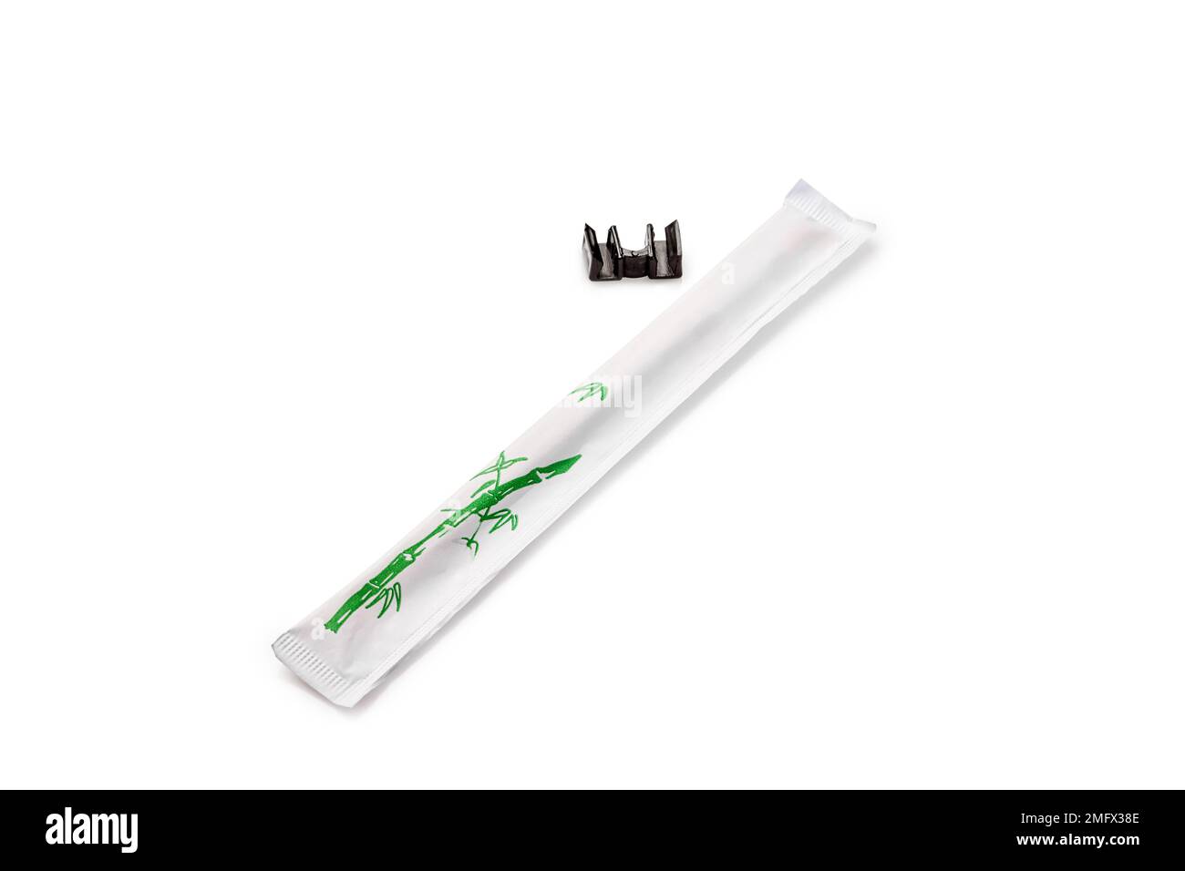 Disposable chopsticks packaged in paper wrapper with printed green ...