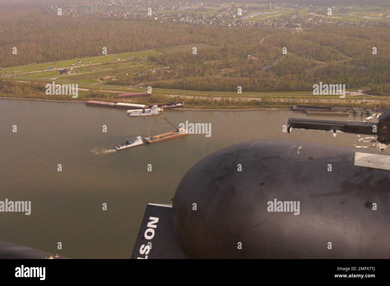 Vice Admiral Vivien Crea - 26-HK-15-28. aerial view of displaced barges ...