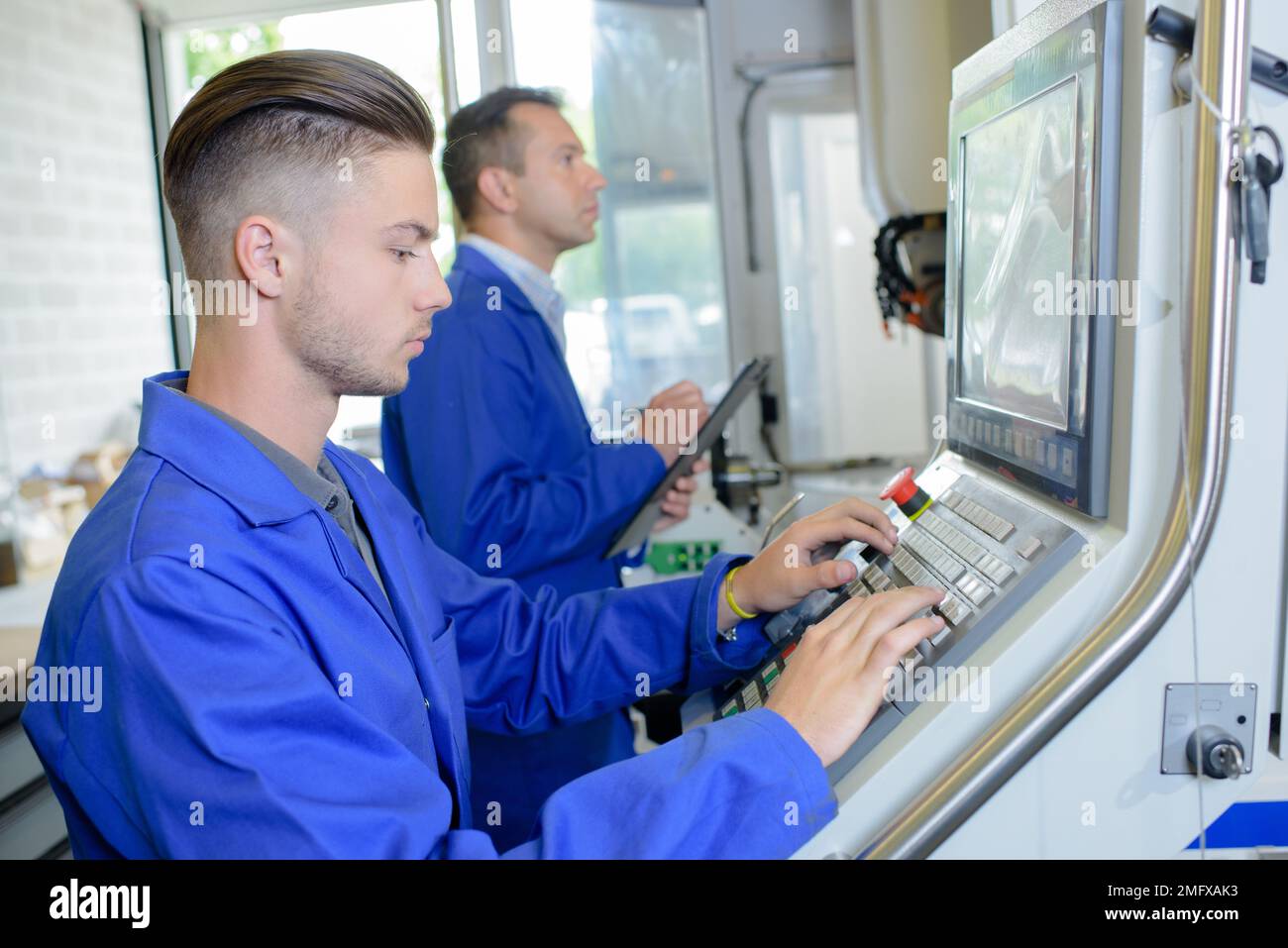 Entering data machine factory hi-res stock photography and images - Alamy