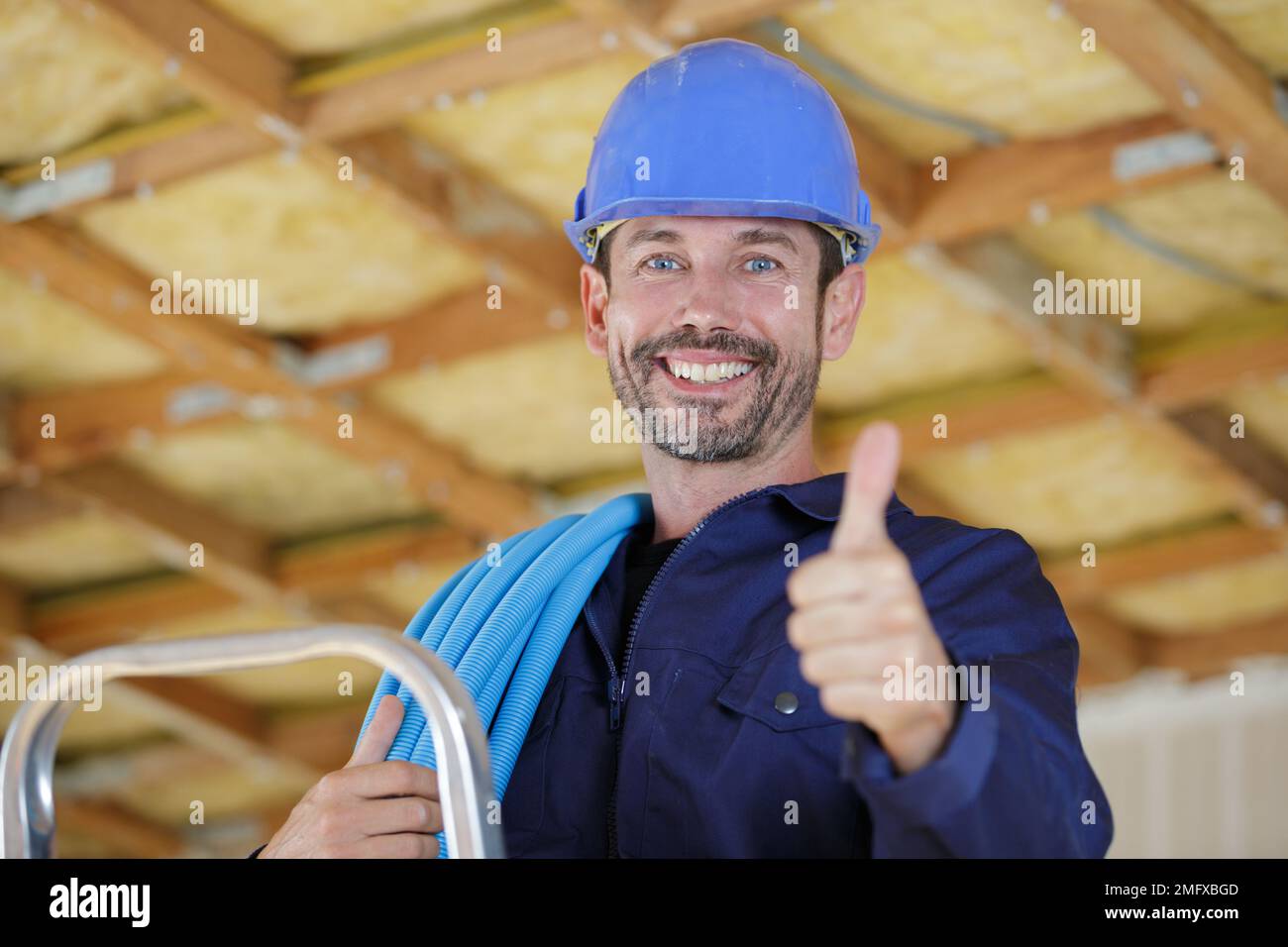 smiling construction inspector his thumb up Stock Photo - Alamy