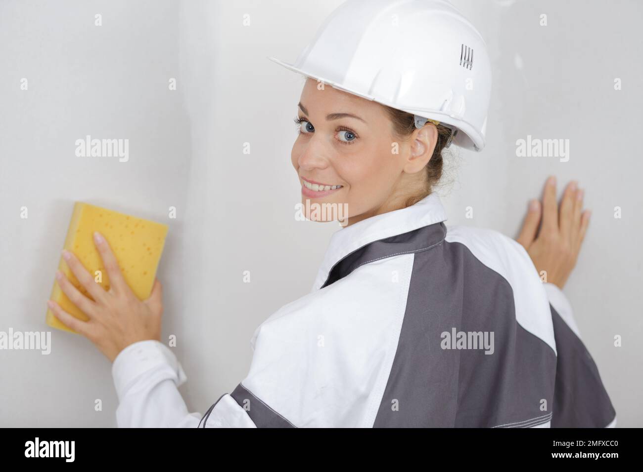 woman cleaning wall before painting Stock Photo - Alamy
