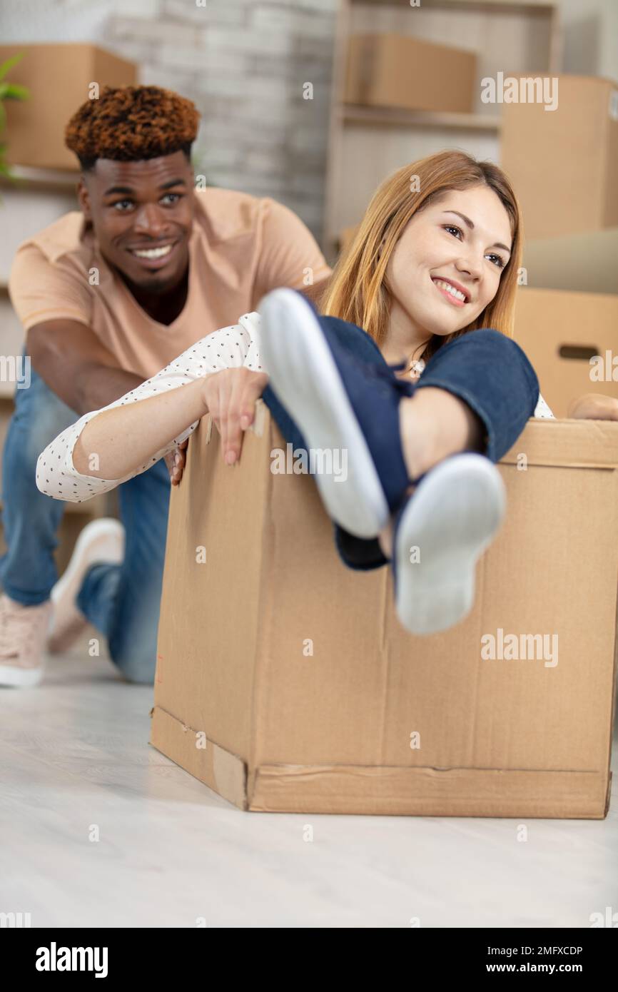 Two people pushing box hi-res stock photography and images - Alamy