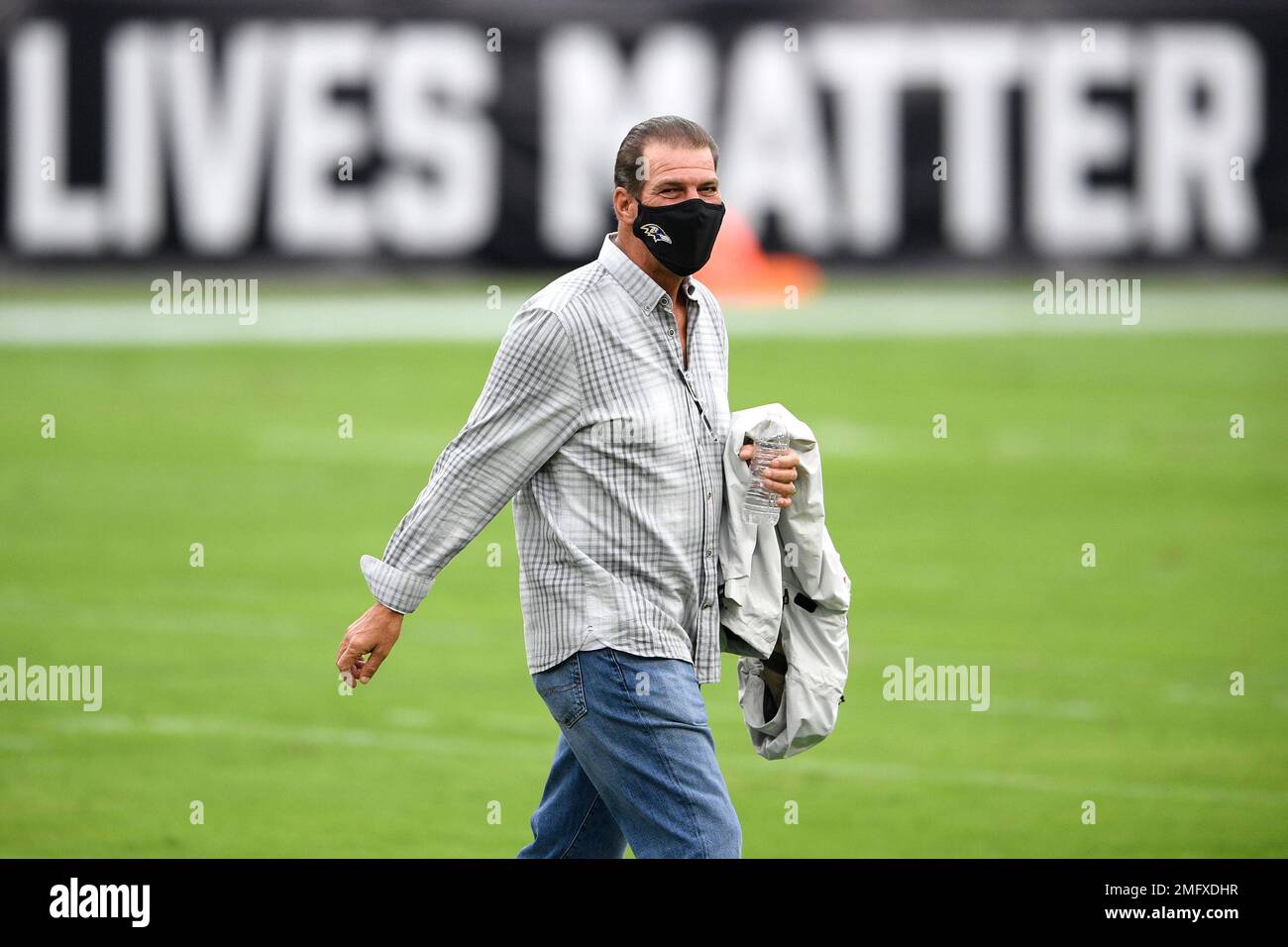 Baltimore Ravens owner Steve Bisciotti walks on the field prior to an ...