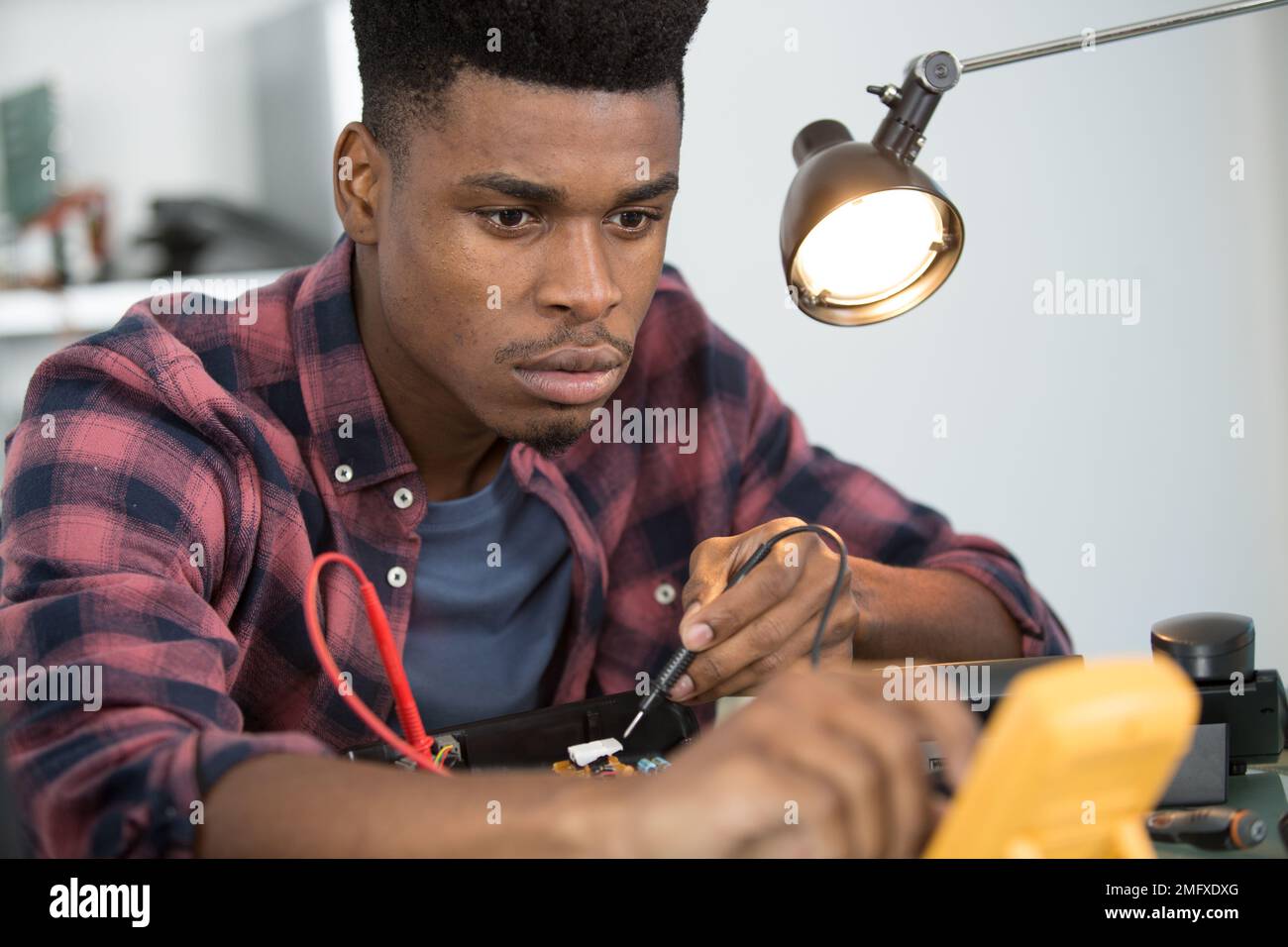 male engineer using a multimeter Stock Photo - Alamy