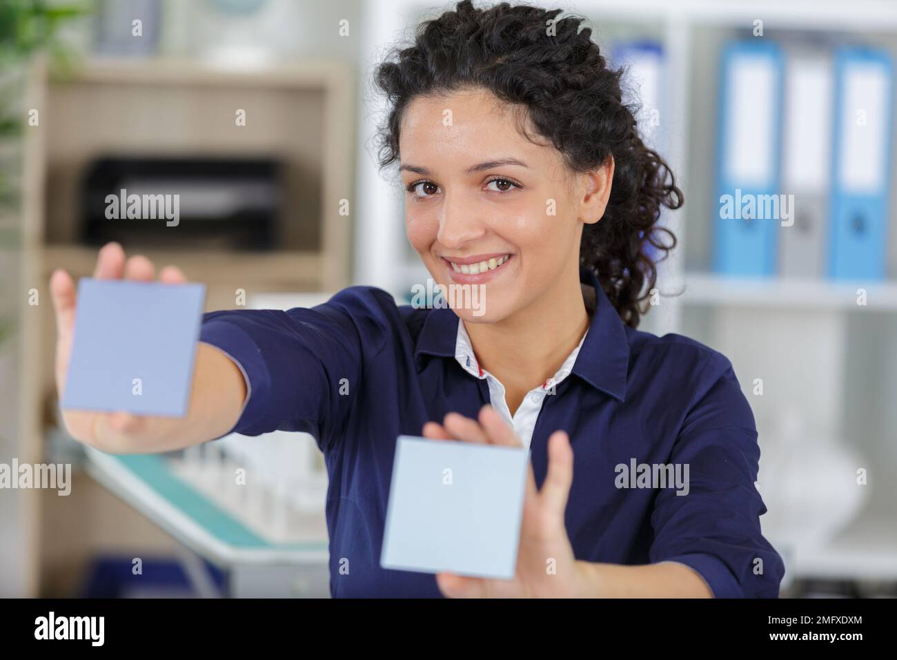 smiling woman showing color palette Stock Photo - Alamy